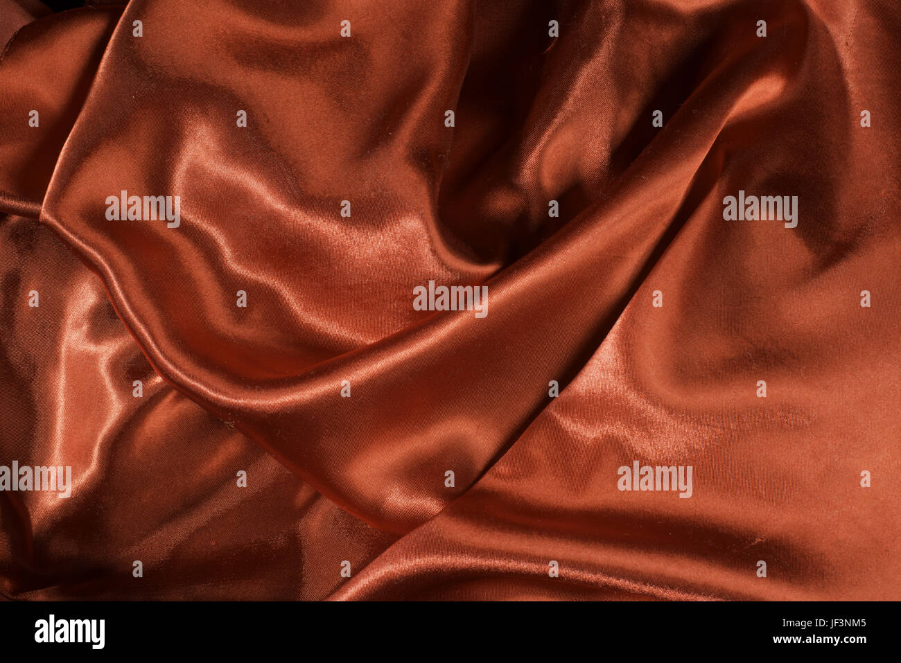 Shiny red satin fabric Stock Photo - Alamy
