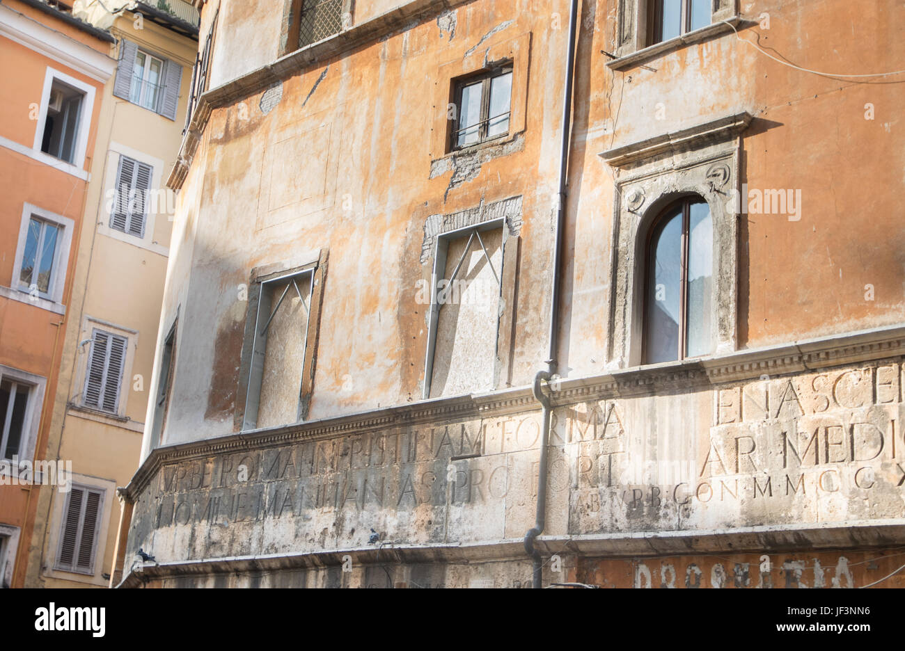 Old building facade with inscriptions in Rome, Italy Stock Photo - Alamy