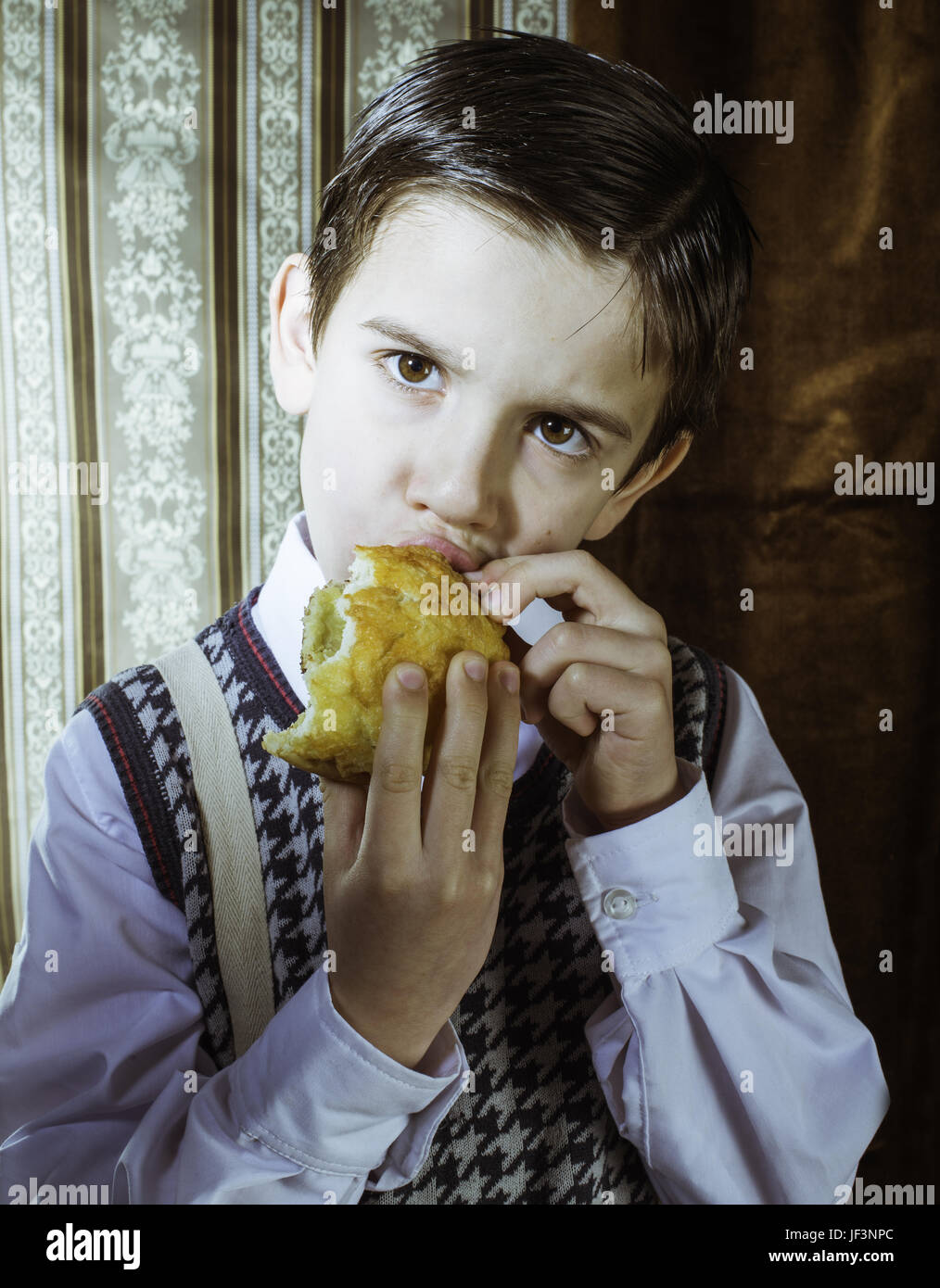 Child who eat. Vintage clothes Stock Photo - Alamy