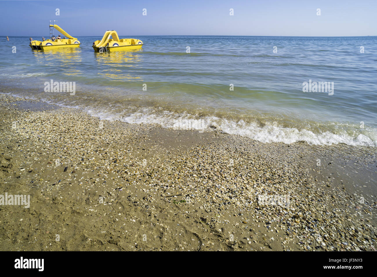 Yellow lifeboat on the beach Stock Photo - Alamy