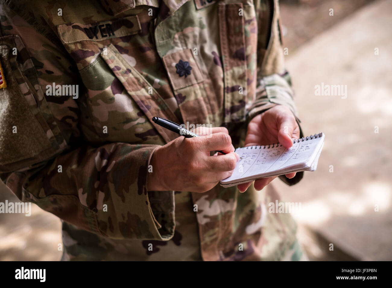 U.S. Army Lt. Col. Rhonda Dyer, Joint Task Force - Bravo, writes down ...
