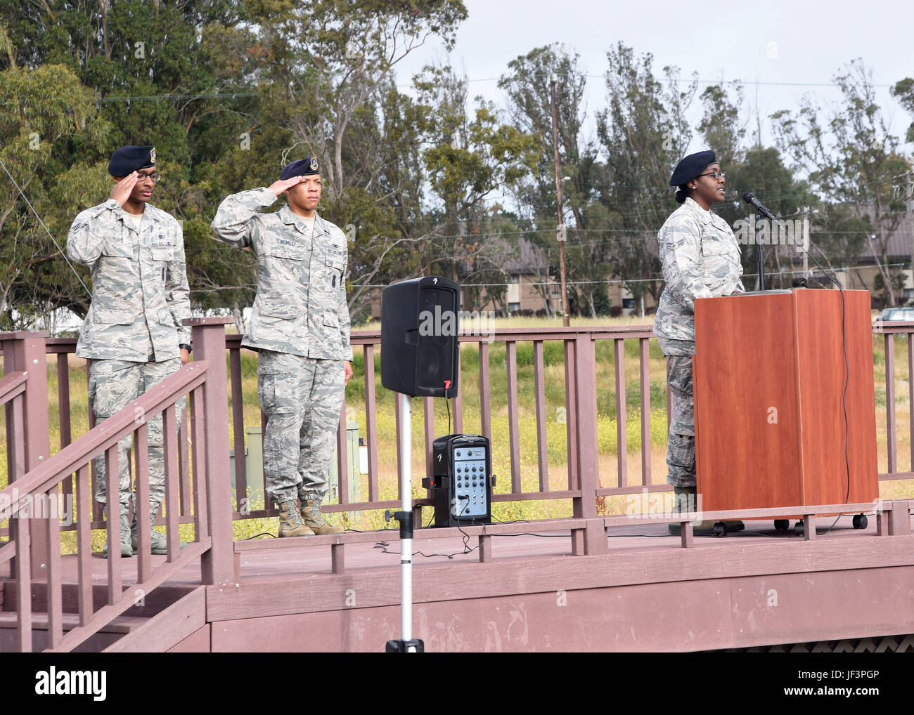 Defenders from the 30th Security Forces Squadron salute as the National ...