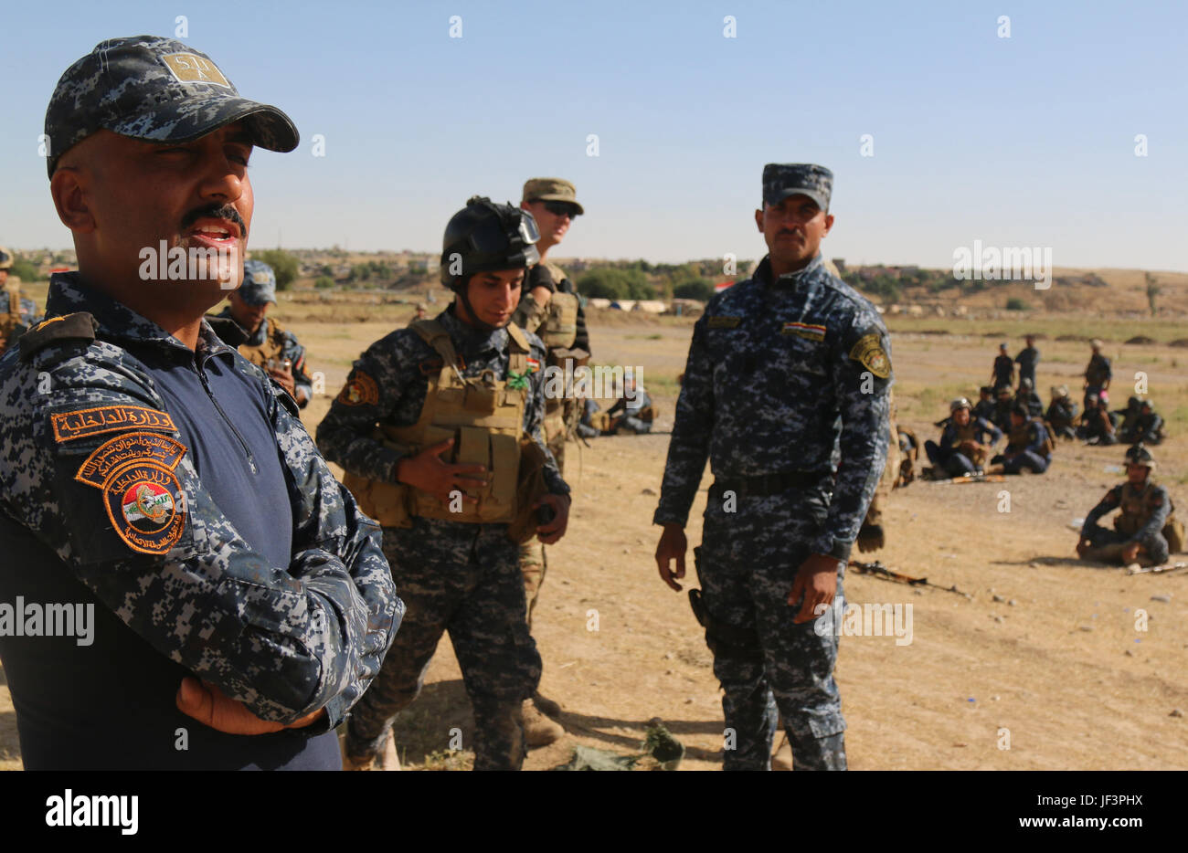 Iraqi Federal Police sniper instructors supervise trainees during an ...