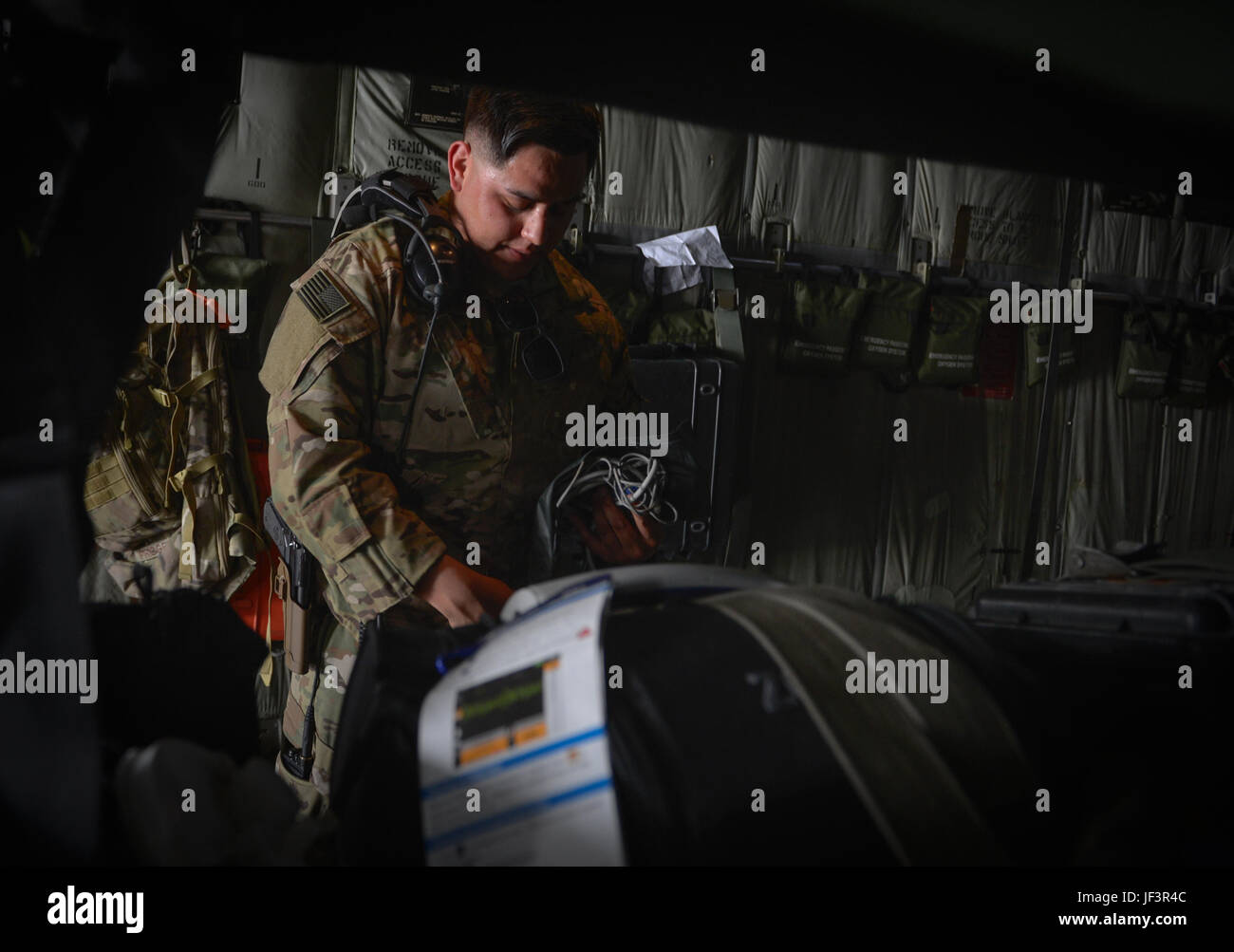 A medical technician from the 379th Expeditionary Aeromedical ...