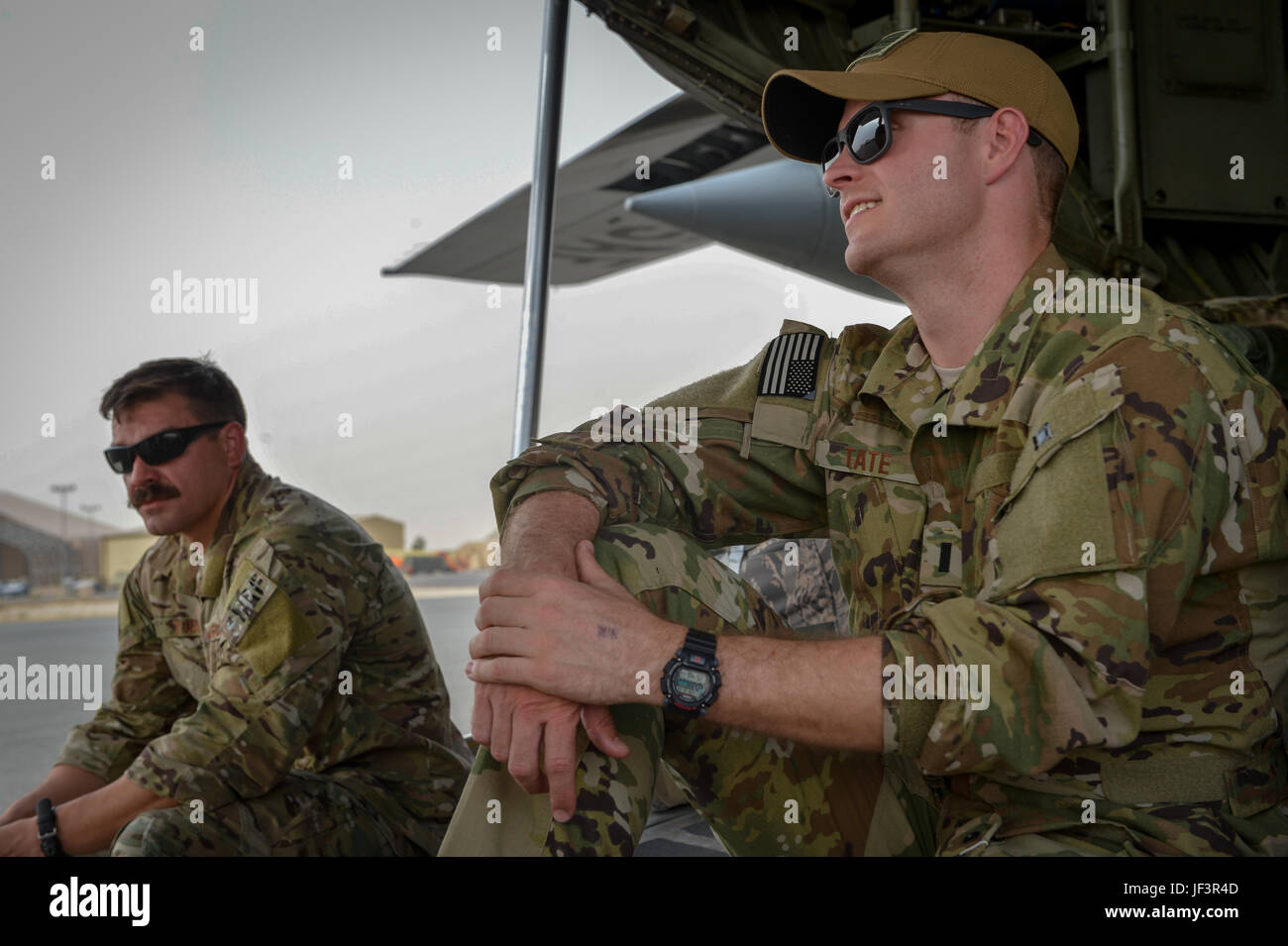 A pilot with the 746th Expeditionary Airlift Squadron sits on the edge ...