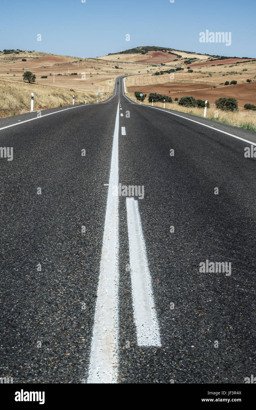 Long asphalt road Stock Photo - Alamy