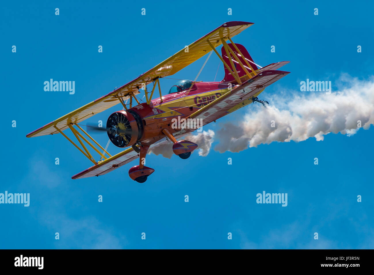 An aerial demonstration aircraft performs stunts for the crowd during ...