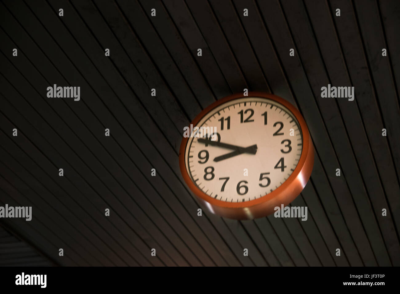 red round wall clock on roof Stock Photo - Alamy