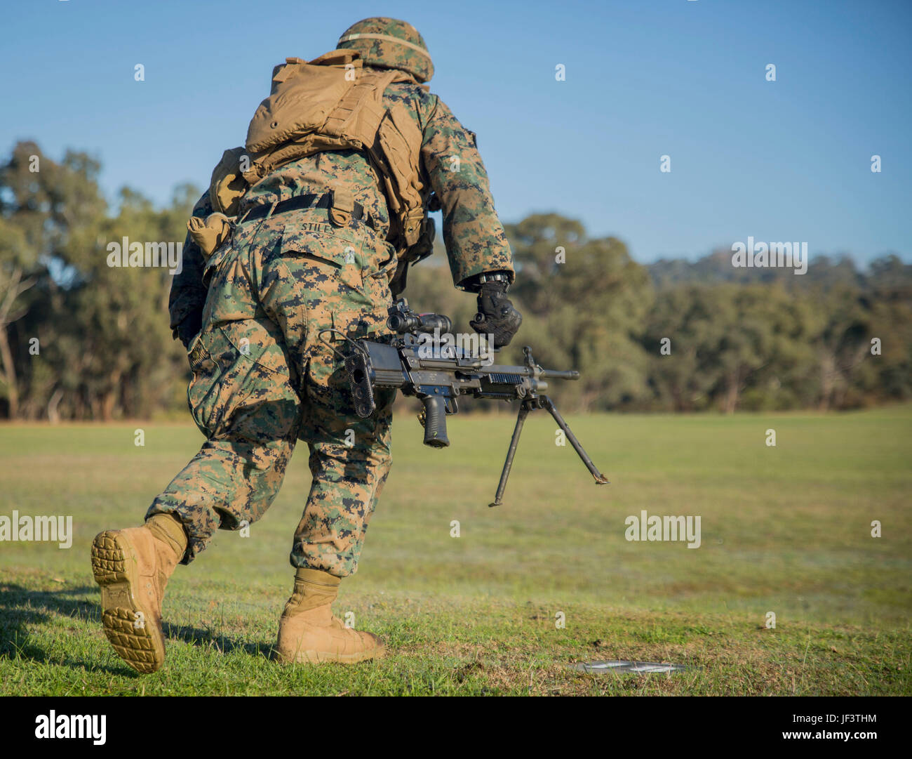 U.S. Marine Corps Sgt. Bryan Stiles quickly jumps up to run to the next ...