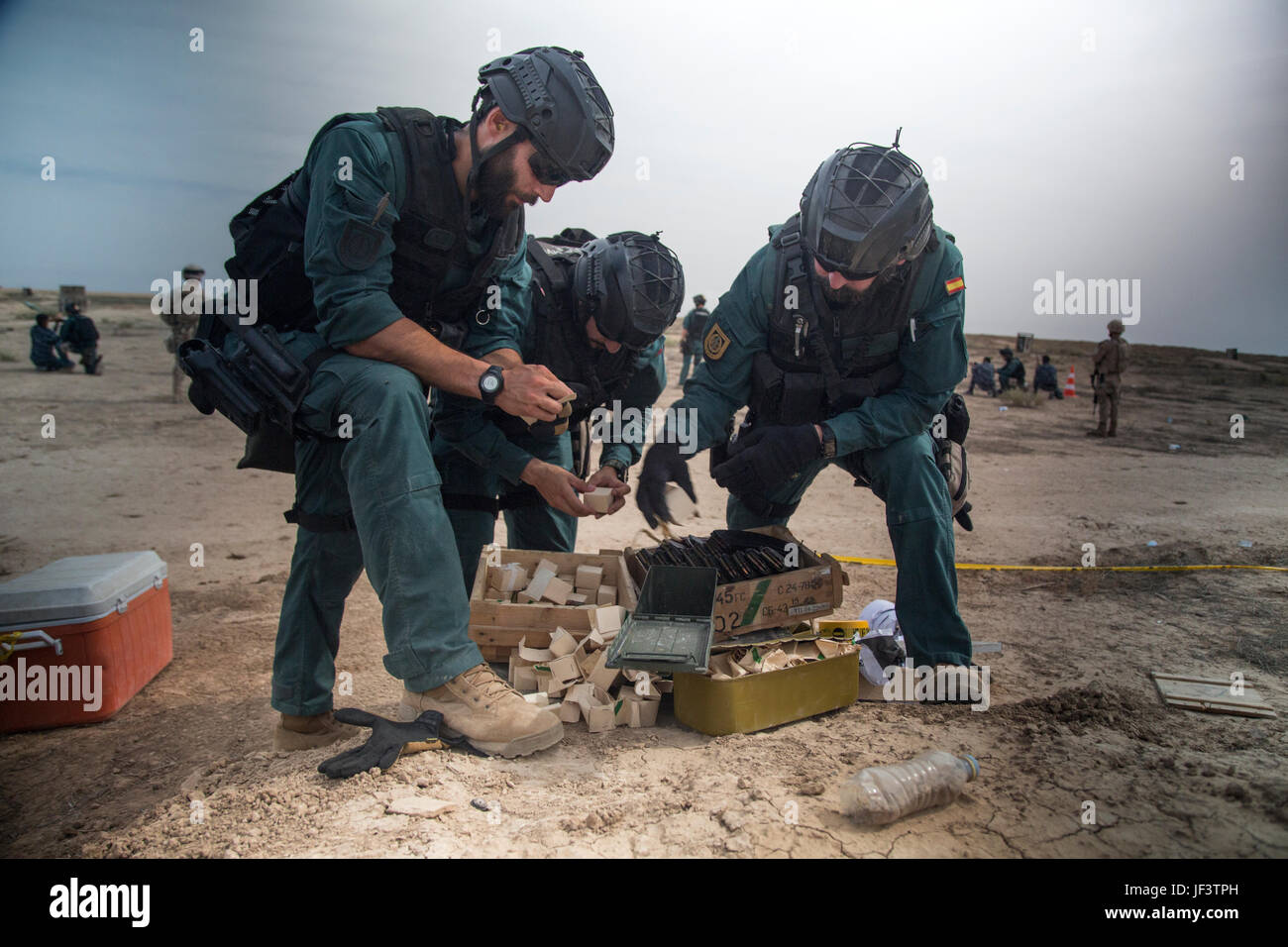 Spanish Guardia Civil trainers load magazines during an AK-47 short ...