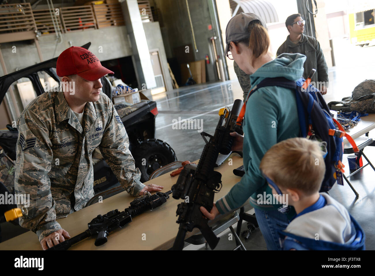 Security Forces Squadron personnel demonstrate weapons safety to family ...