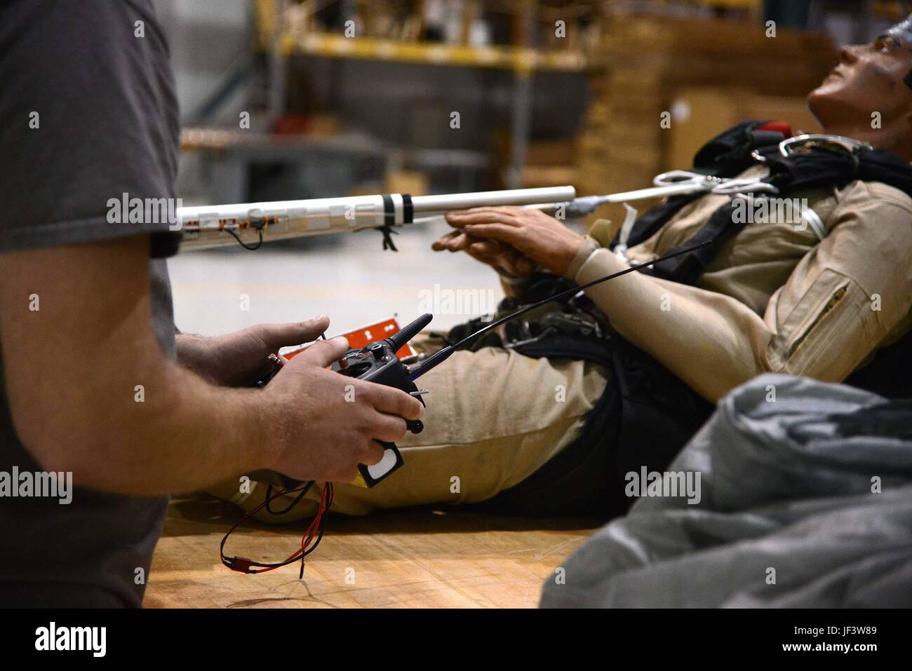 Trever Bush, 412th OSS Parachute Test Team, demonstrates the operation ...