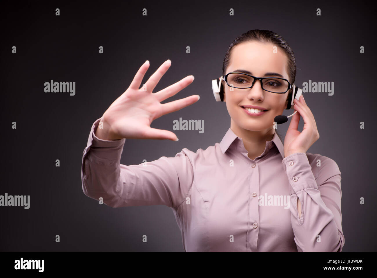 Helpdesk operator in communication concept Stock Photo - Alamy