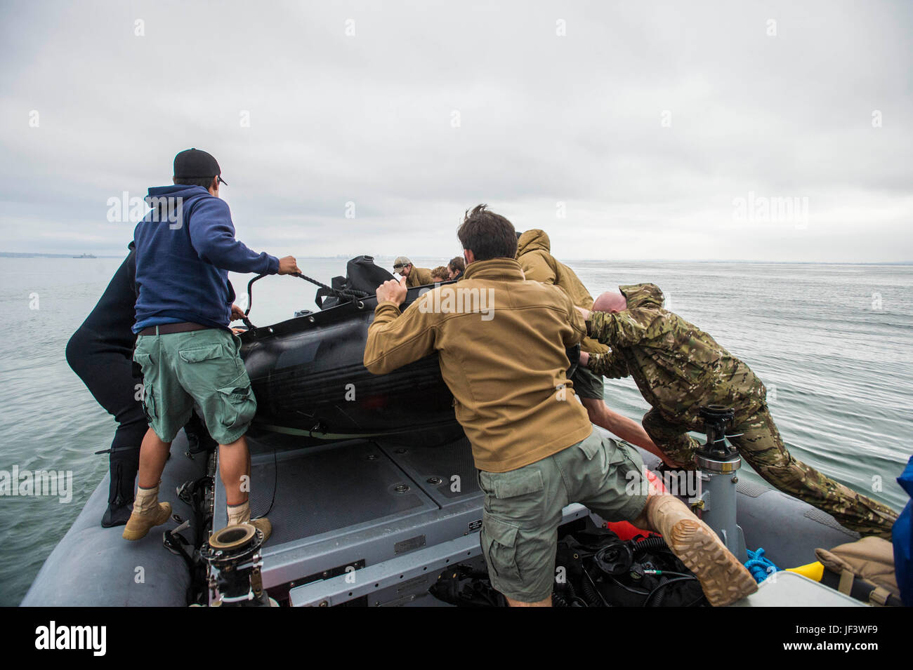 U.S. Navy Sailors assigned to Explosive Ordnance Disposal Group One ...