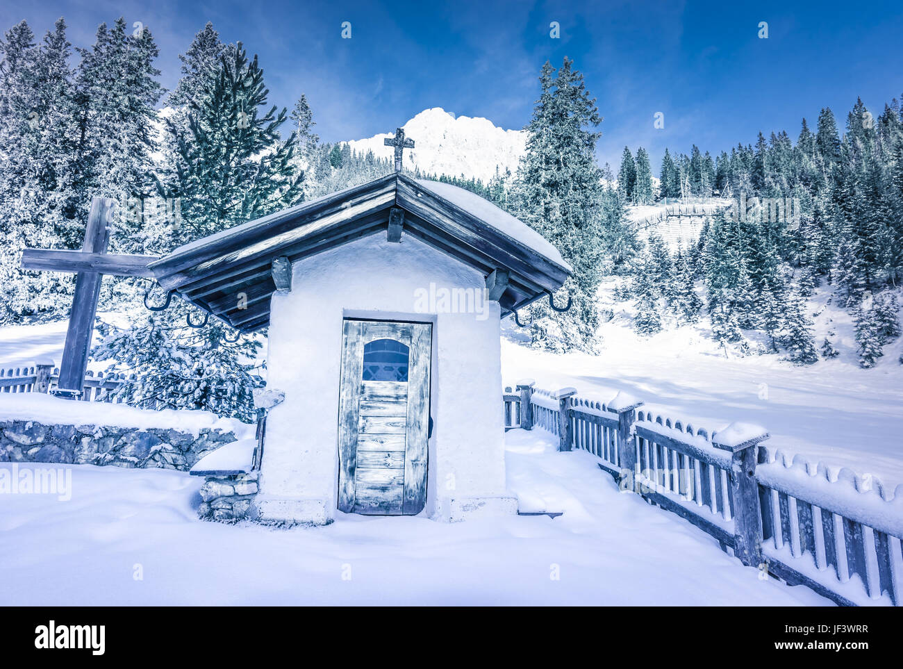 Alpine rustic chapel in winter decor Stock Photo - Alamy