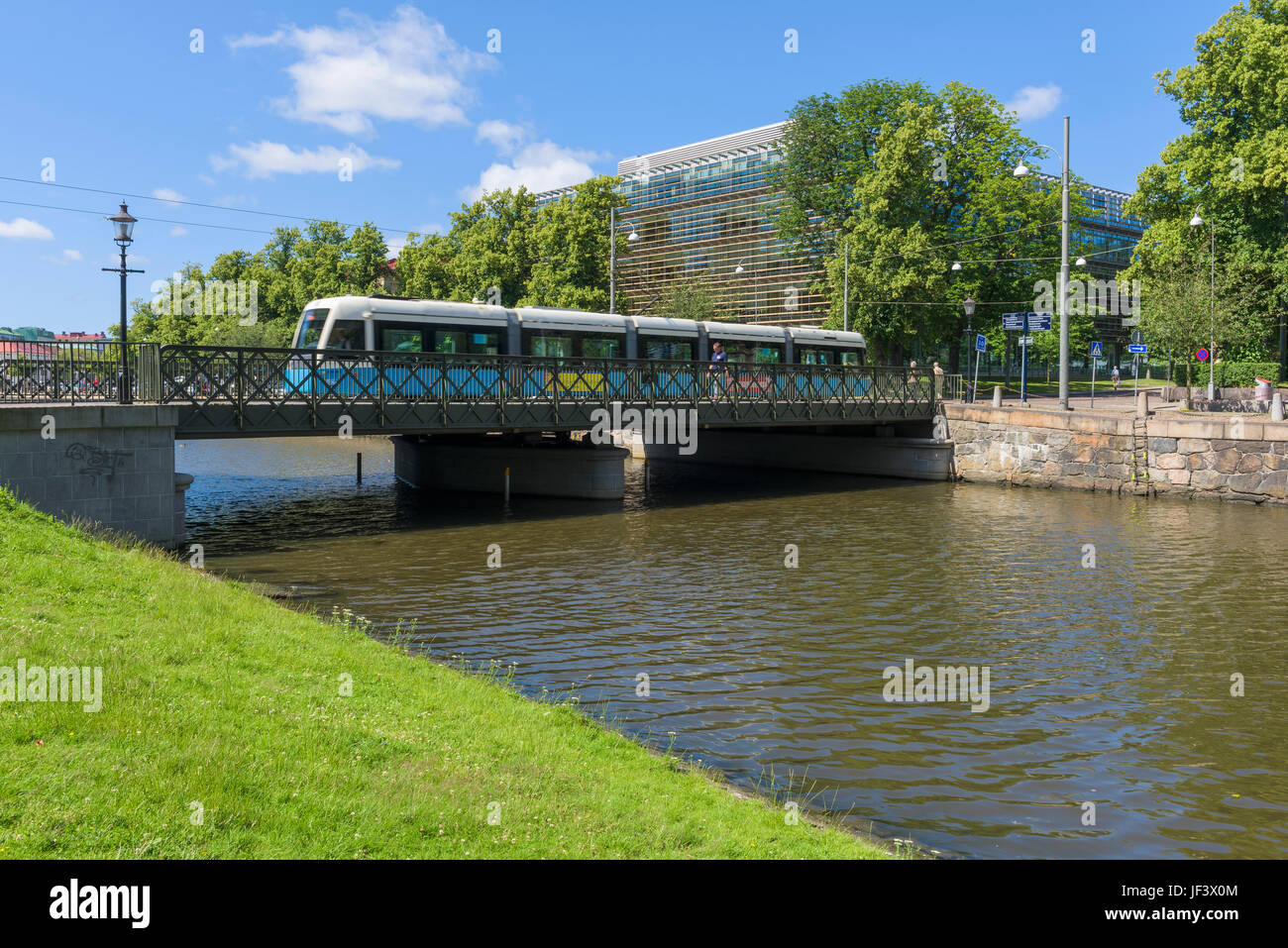 Tram driving through bridge Stock Photo - Alamy