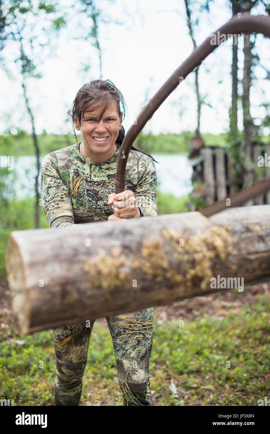Woman using saw Stock Photo - Alamy