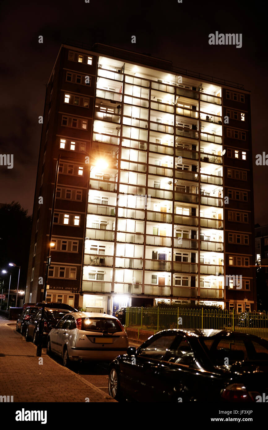 Illuminated block of flats at night Stock Photo - Alamy