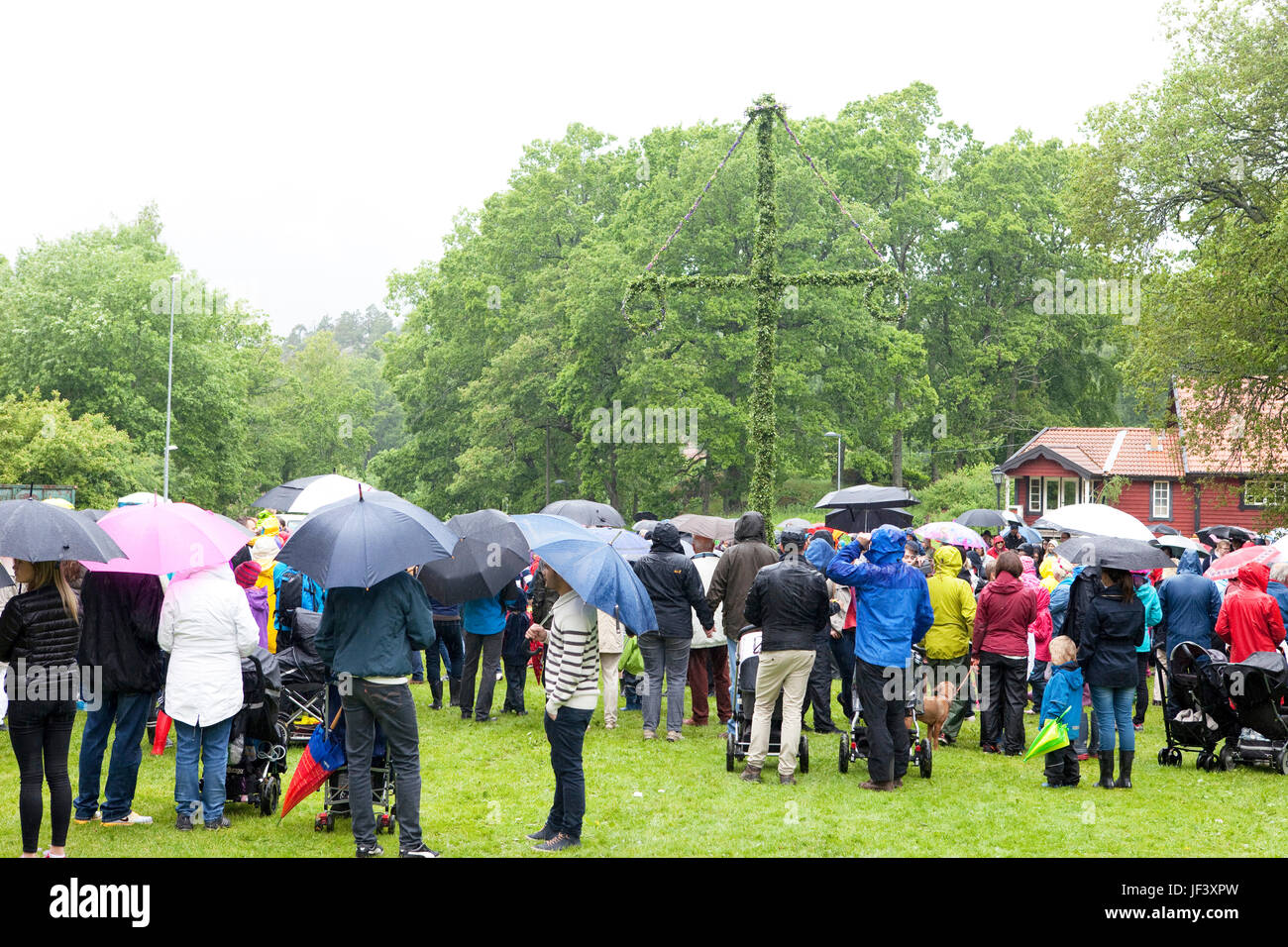 People around maypole Stock Photo - Alamy