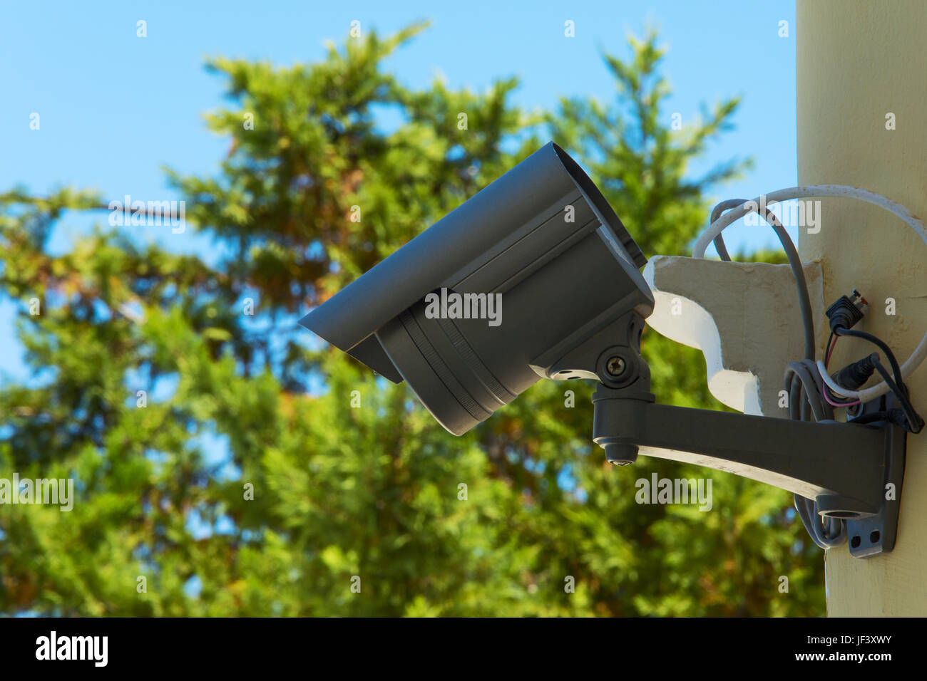 CCTV camera mounted on a building wall Stock Photo - Alamy