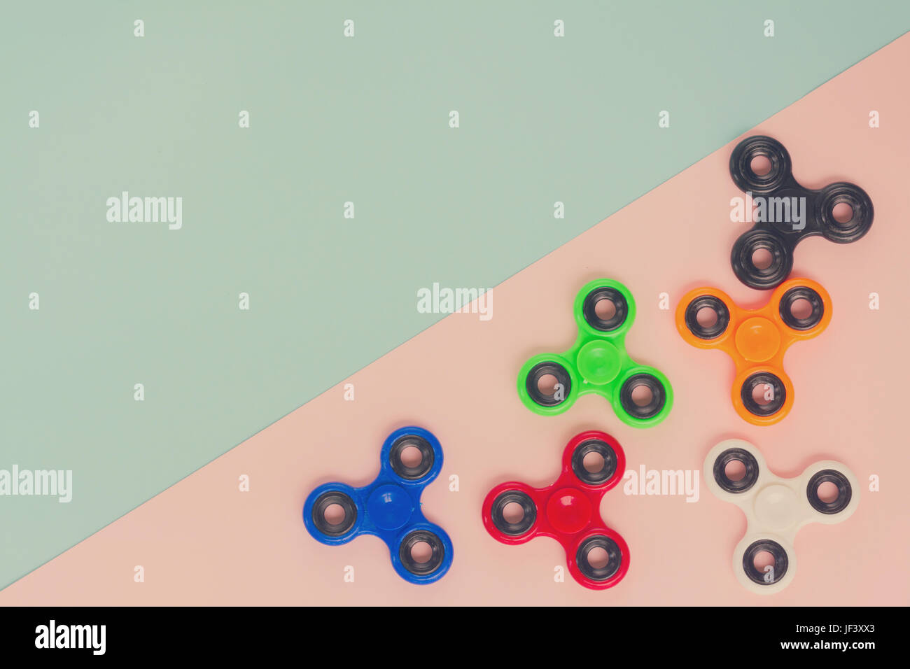 trendy fidget spinners - styled pop art flat lay scene with generic ...