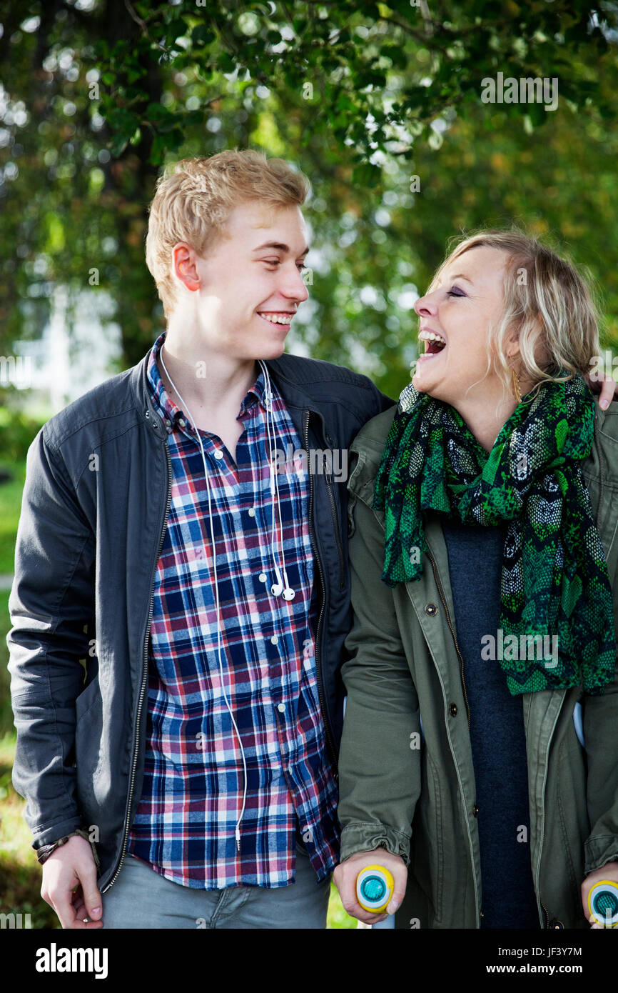 Young man with mother Stock Photo - Alamy