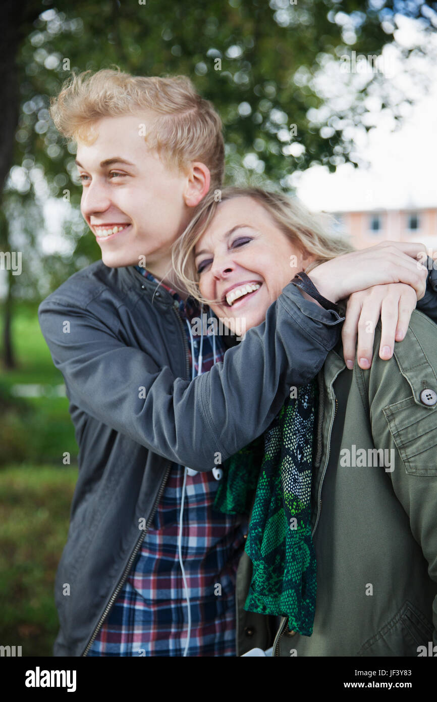Young man with mother Stock Photo - Alamy