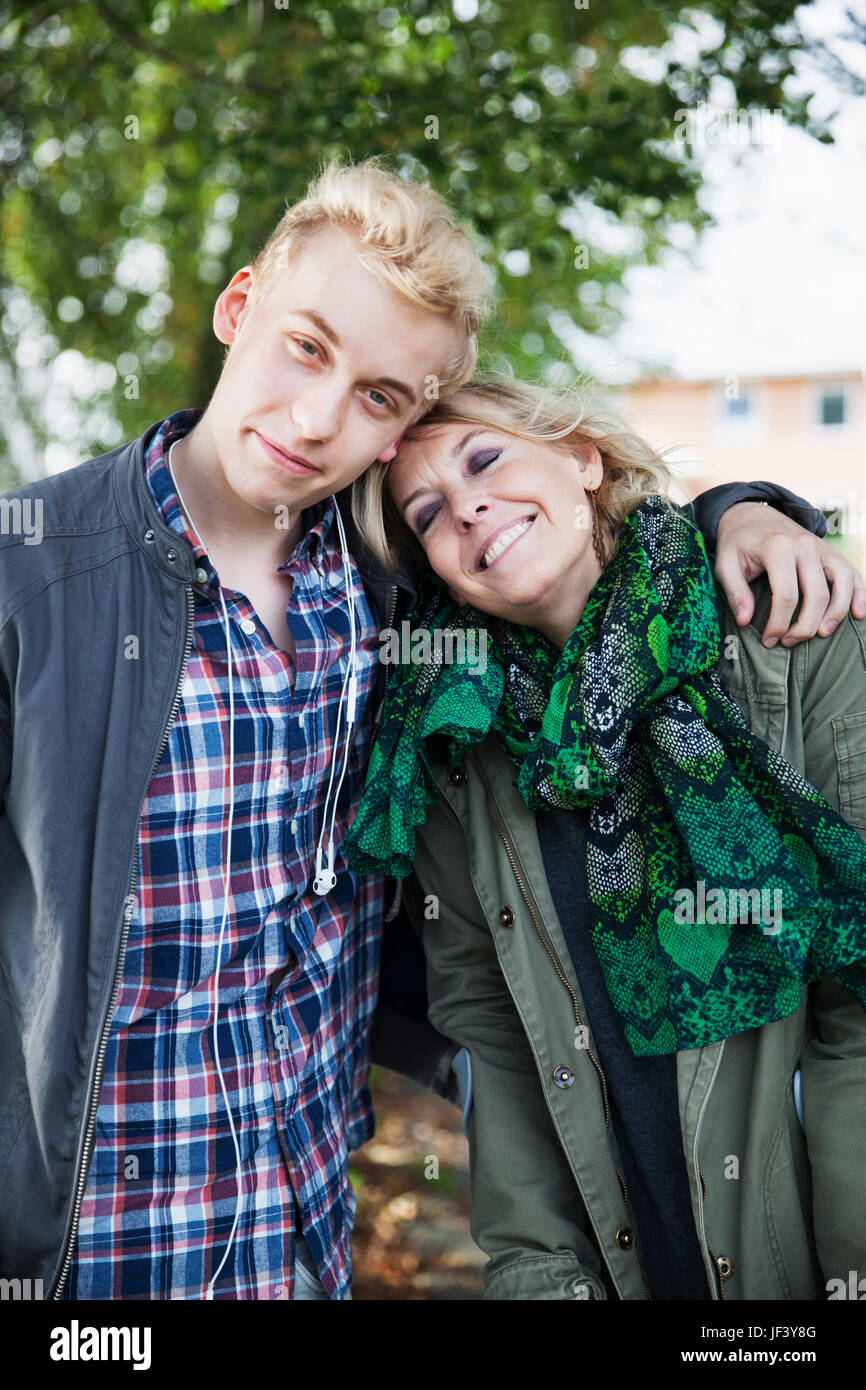 Young man with mother Stock Photo - Alamy