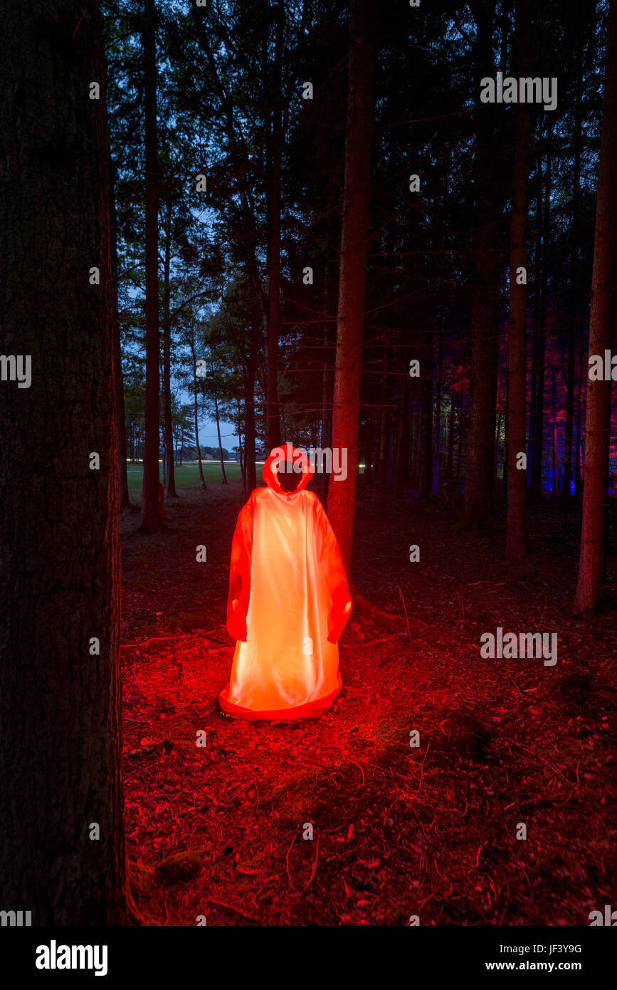 Illuminated red figure in hi-res stock photography and images - Alamy
