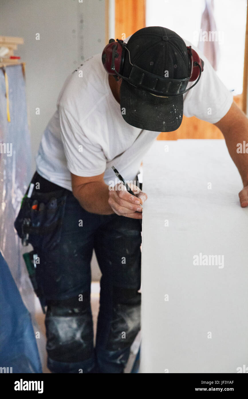 Man renovating house Stock Photo - Alamy