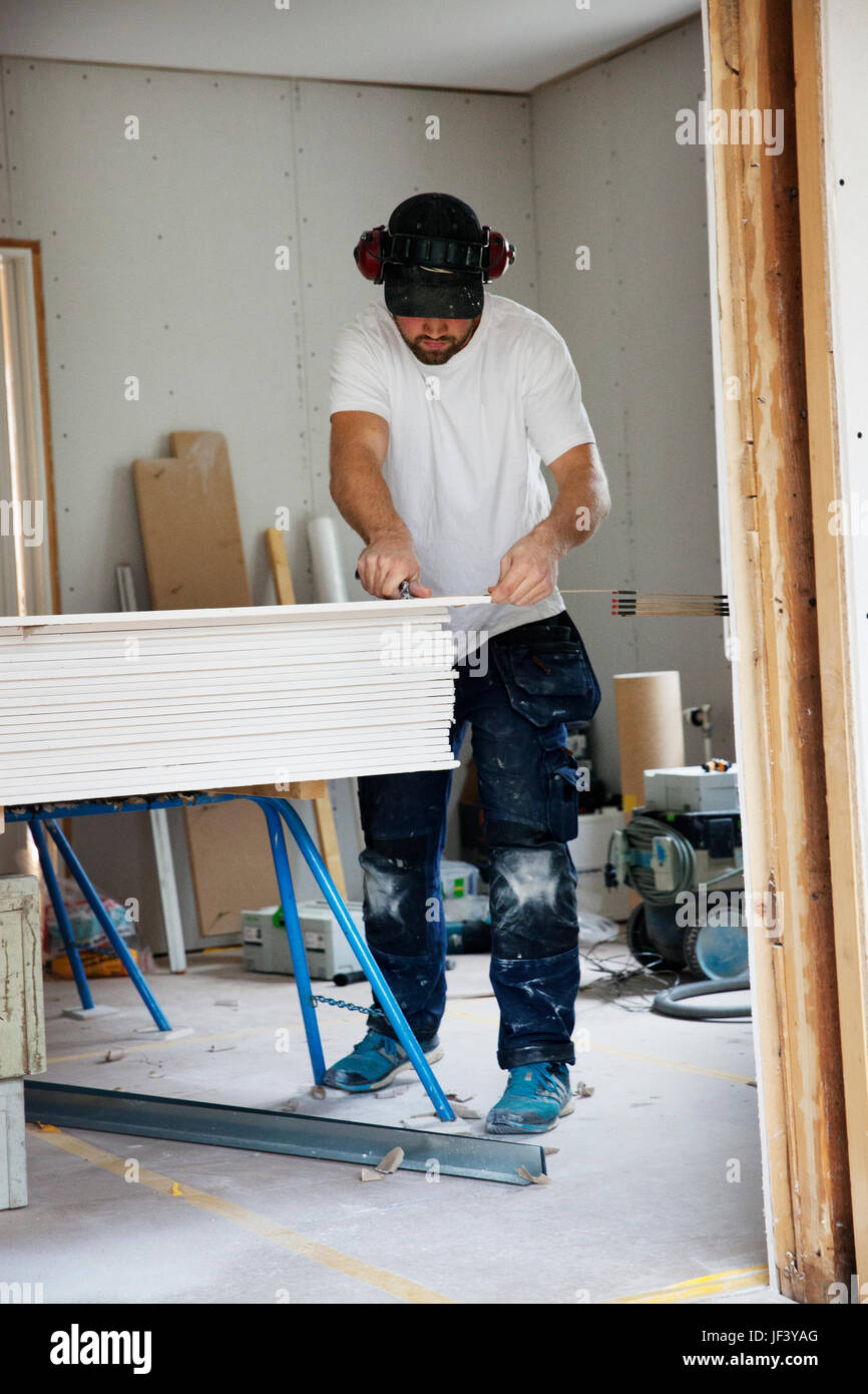 Man renovating house Stock Photo - Alamy