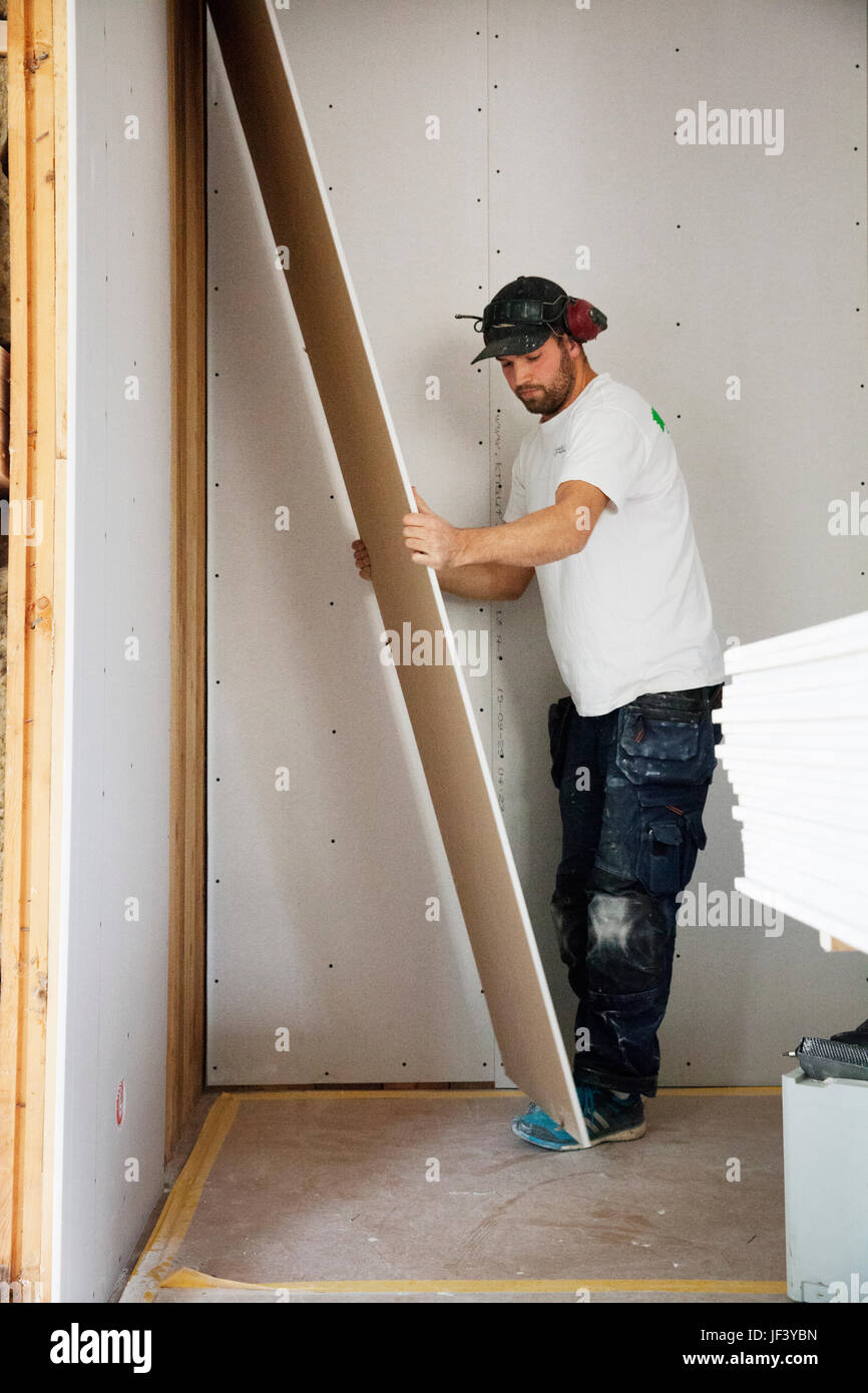 Man renovating house Stock Photo - Alamy