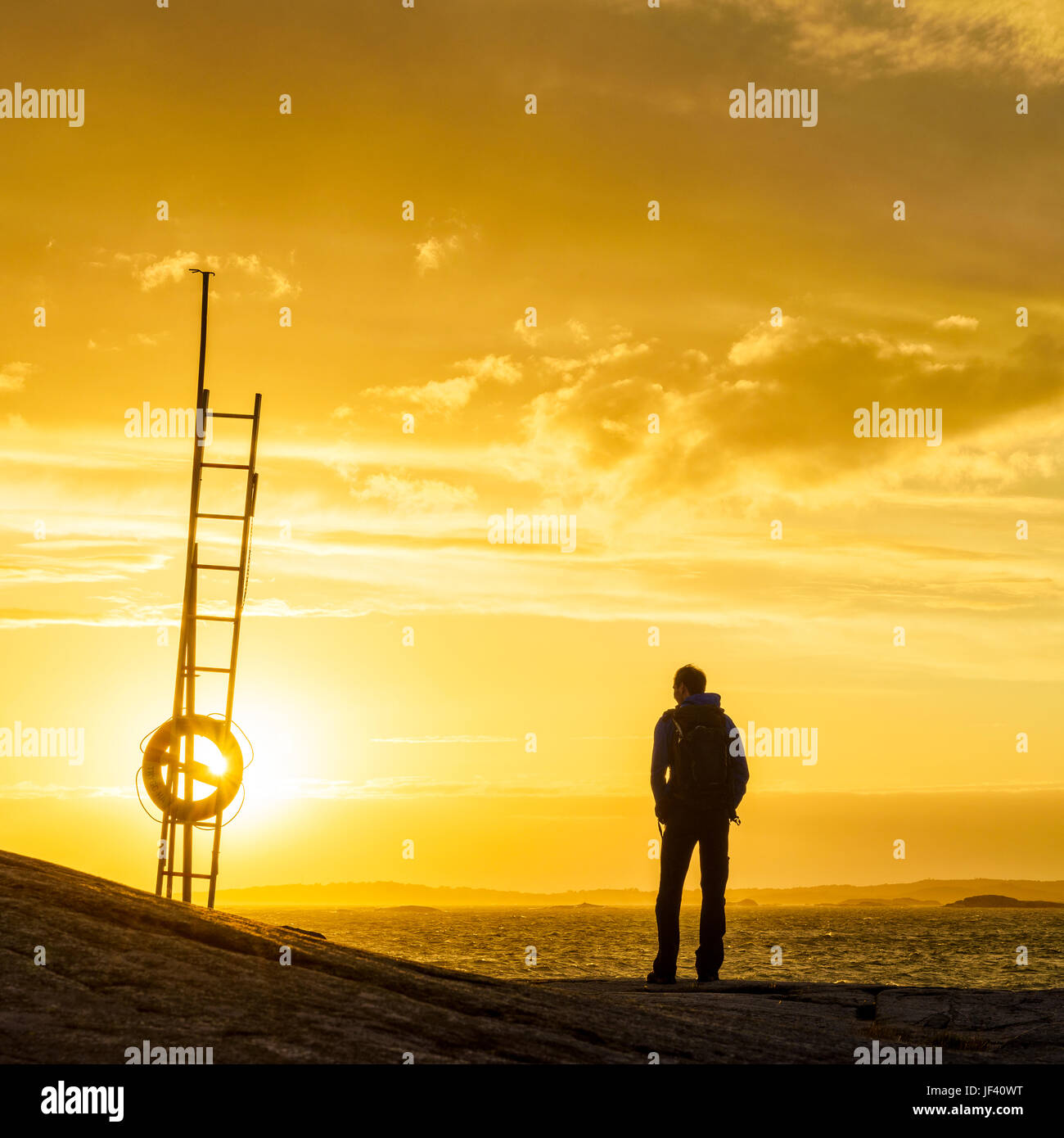 Man watching sunset hi-res stock photography and images - Alamy
