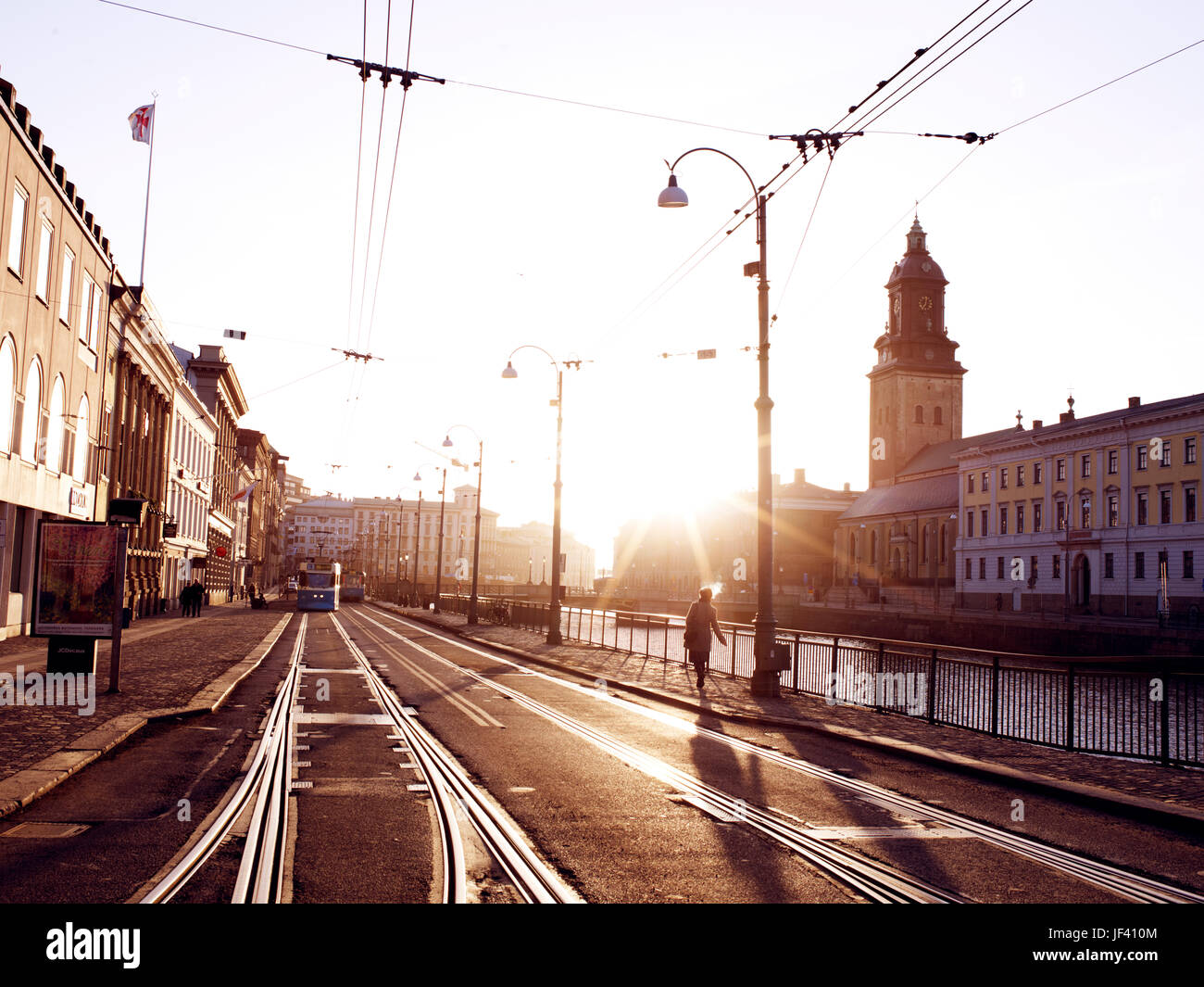 Street with tram tracks in city Stock Photo - Alamy