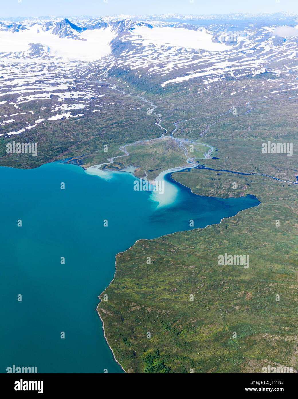 Streams merging with lake water Stock Photo - Alamy