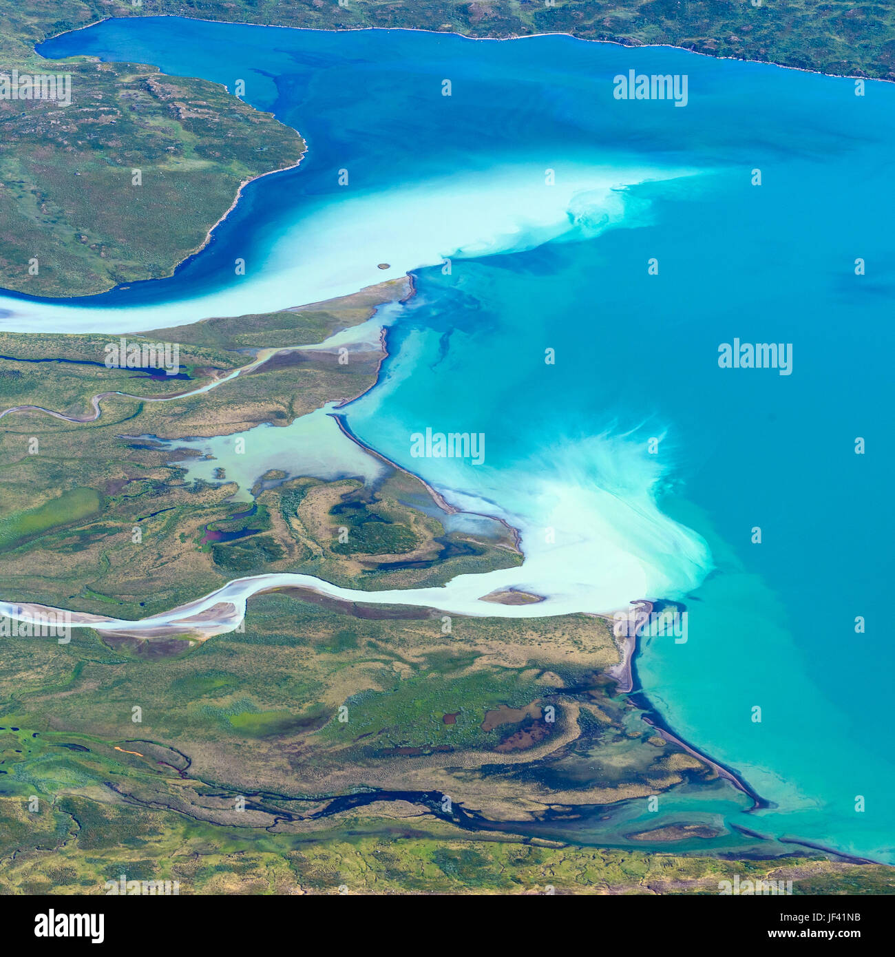 Streams merging with lake water Stock Photo - Alamy