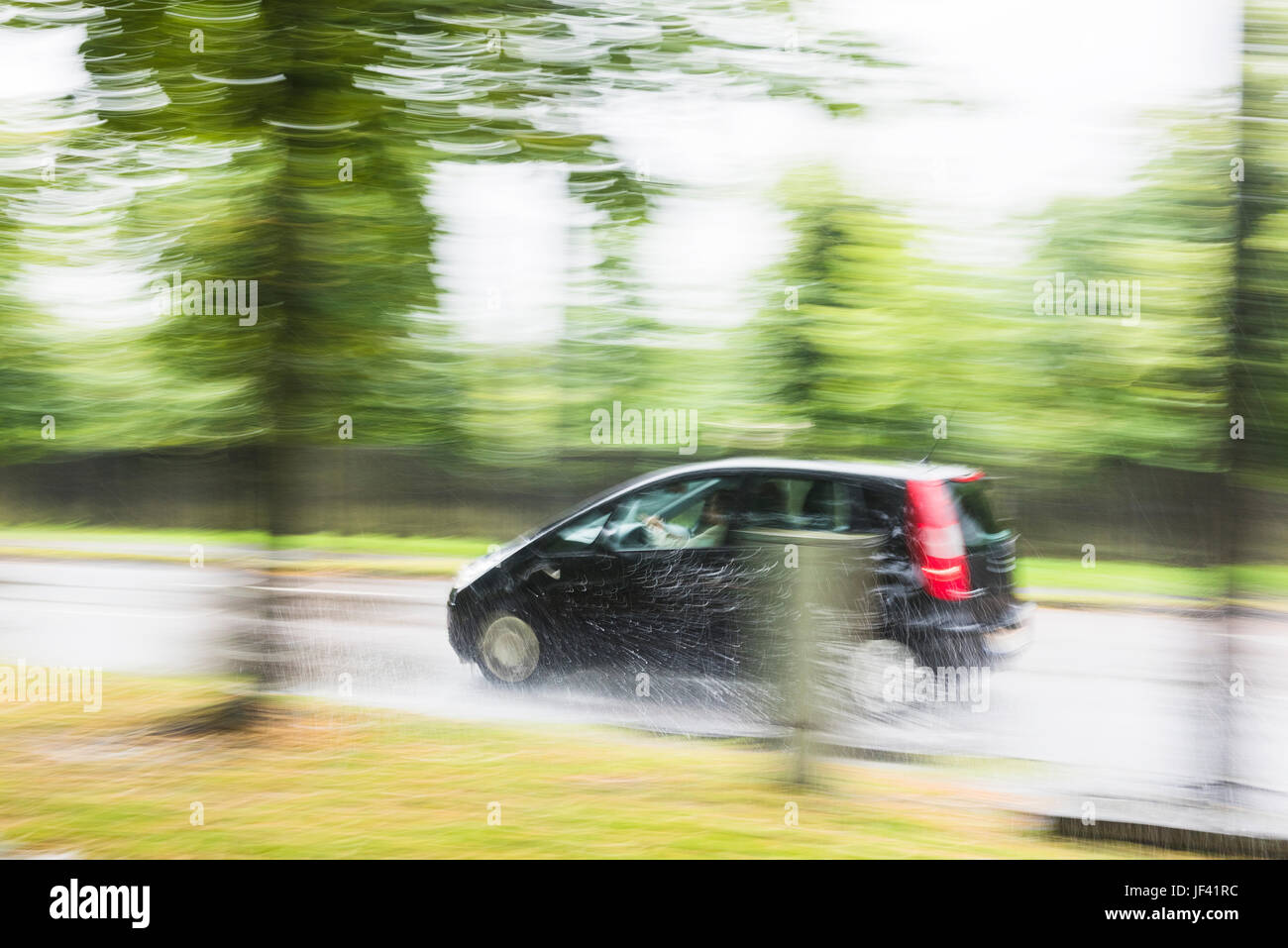 Car on wet road hi-res stock photography and images - Alamy