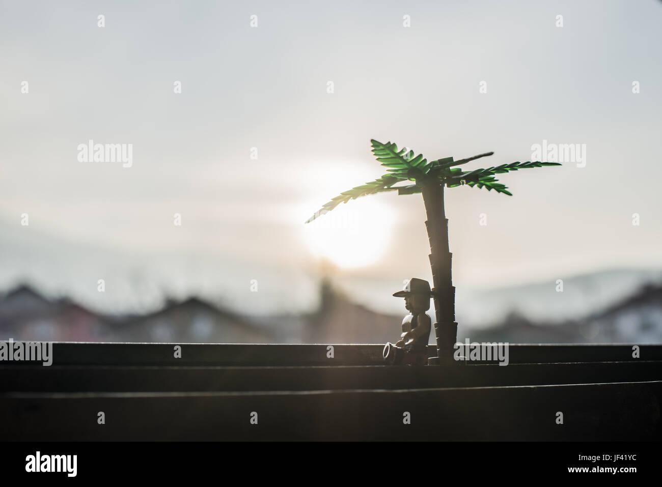 Figures of palm tree and man Stock Photo - Alamy