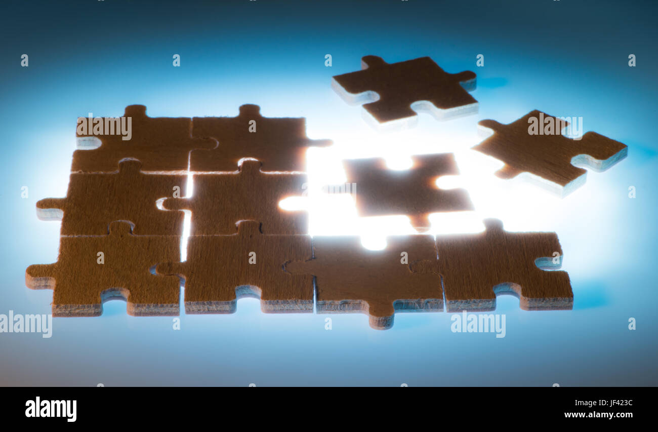 Wooden puzzle and backlight background Stock Photo - Alamy
