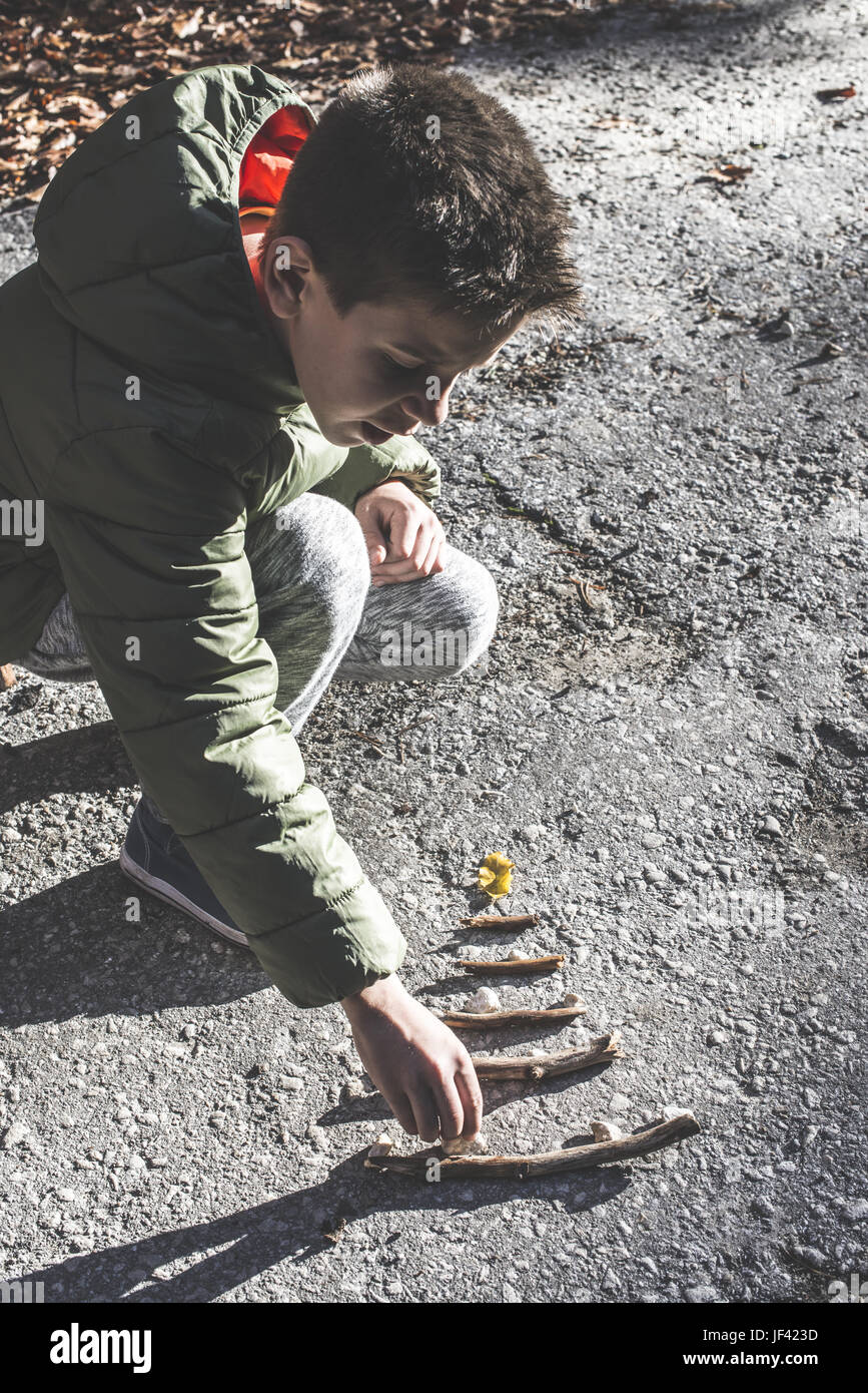 Child make pine tree Stock Photo - Alamy