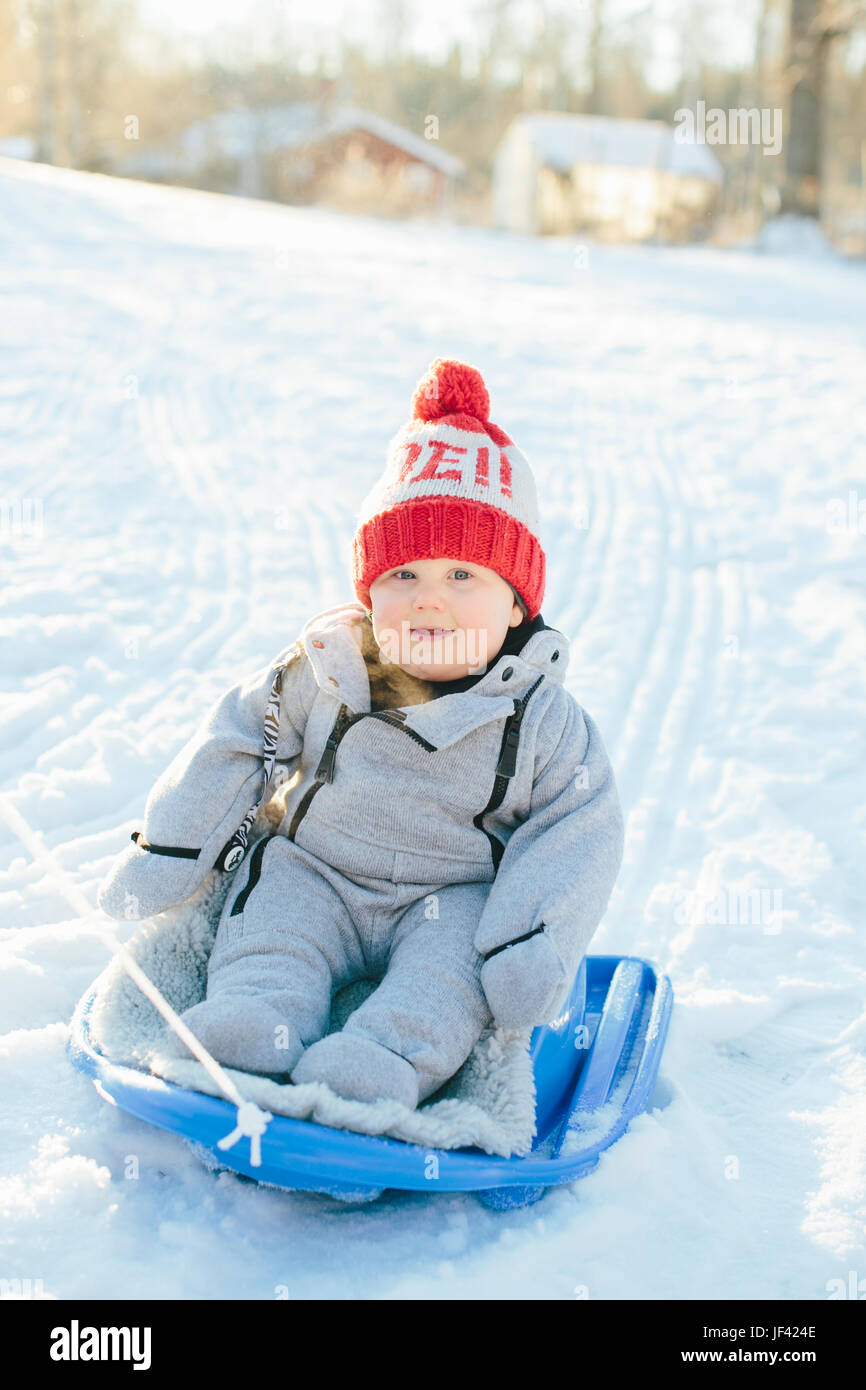 Baby on sledge Stock Photo - Alamy