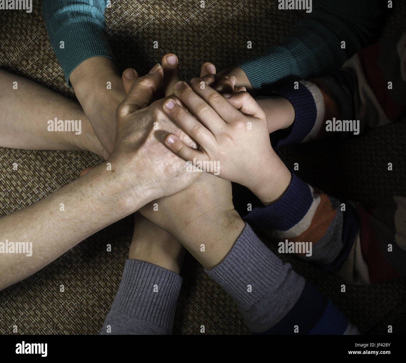 Many hands together Stock Photo - Alamy