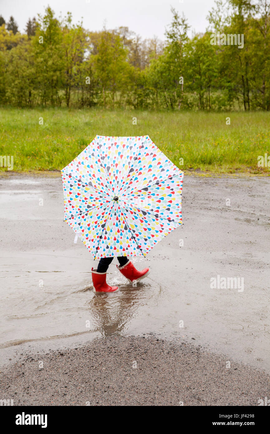 Walking through puddle hi-res stock photography and images - Alamy