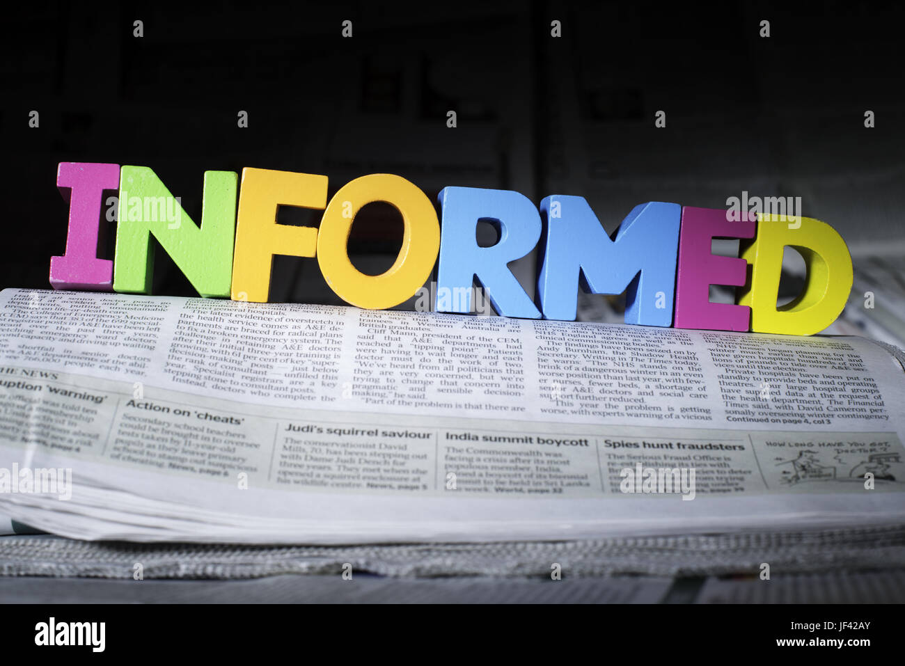 Word informed on newspaper Stock Photo - Alamy