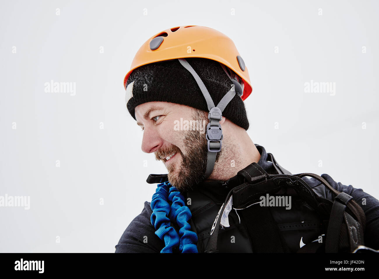 Smiling climber looking away Stock Photo - Alamy