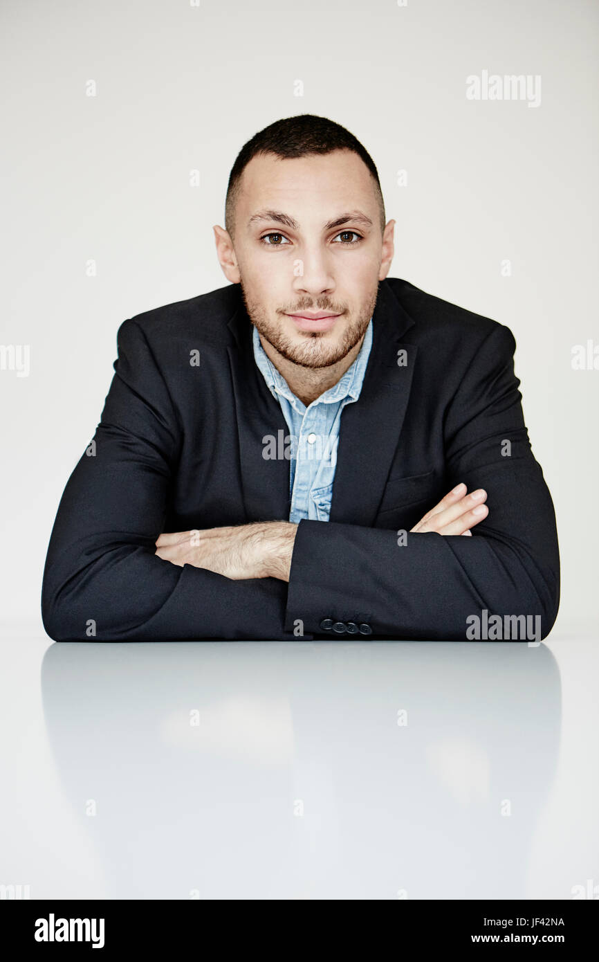 Young man looking at camera Stock Photo - Alamy