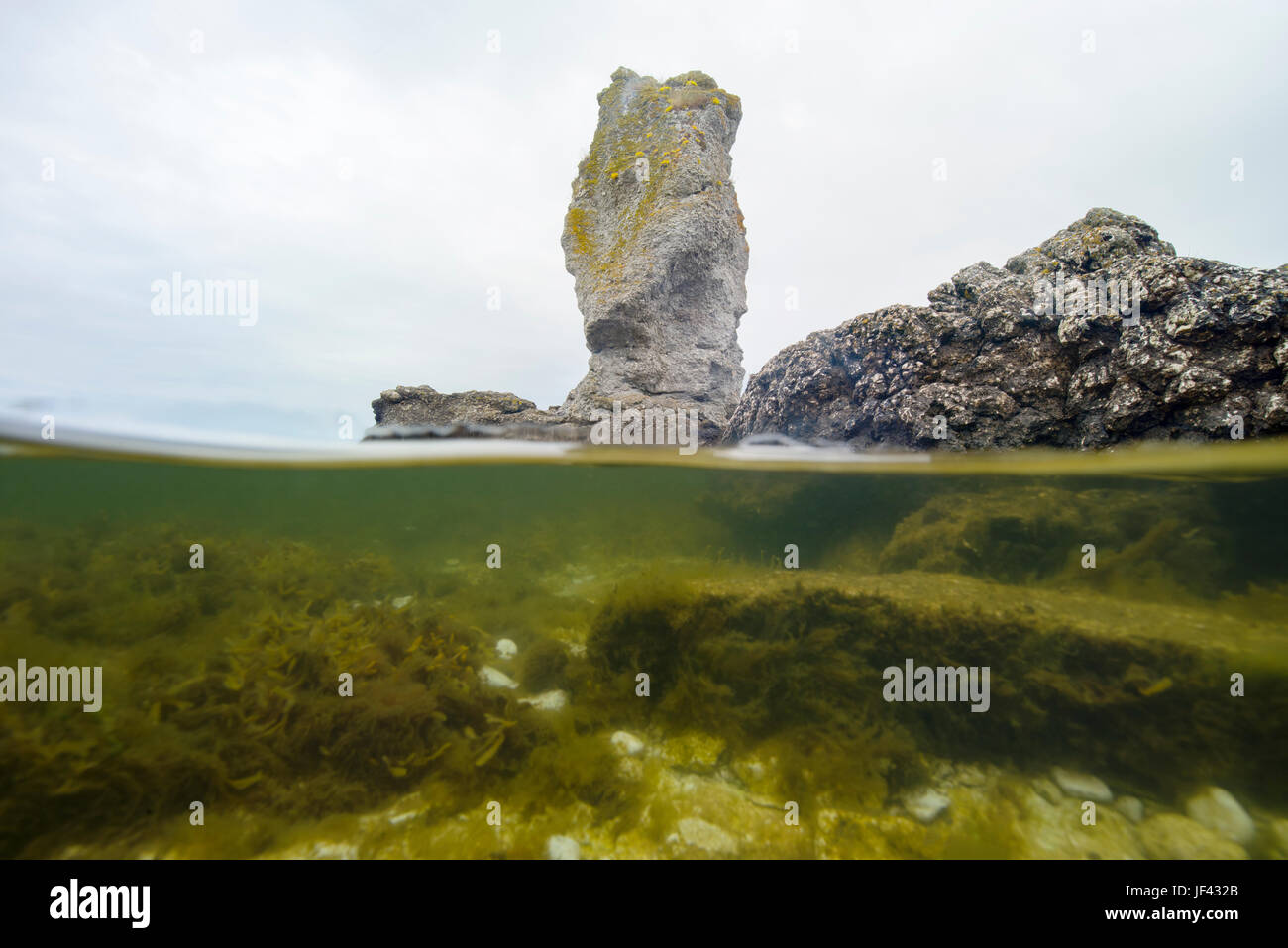 Rock in sea Stock Photo - Alamy