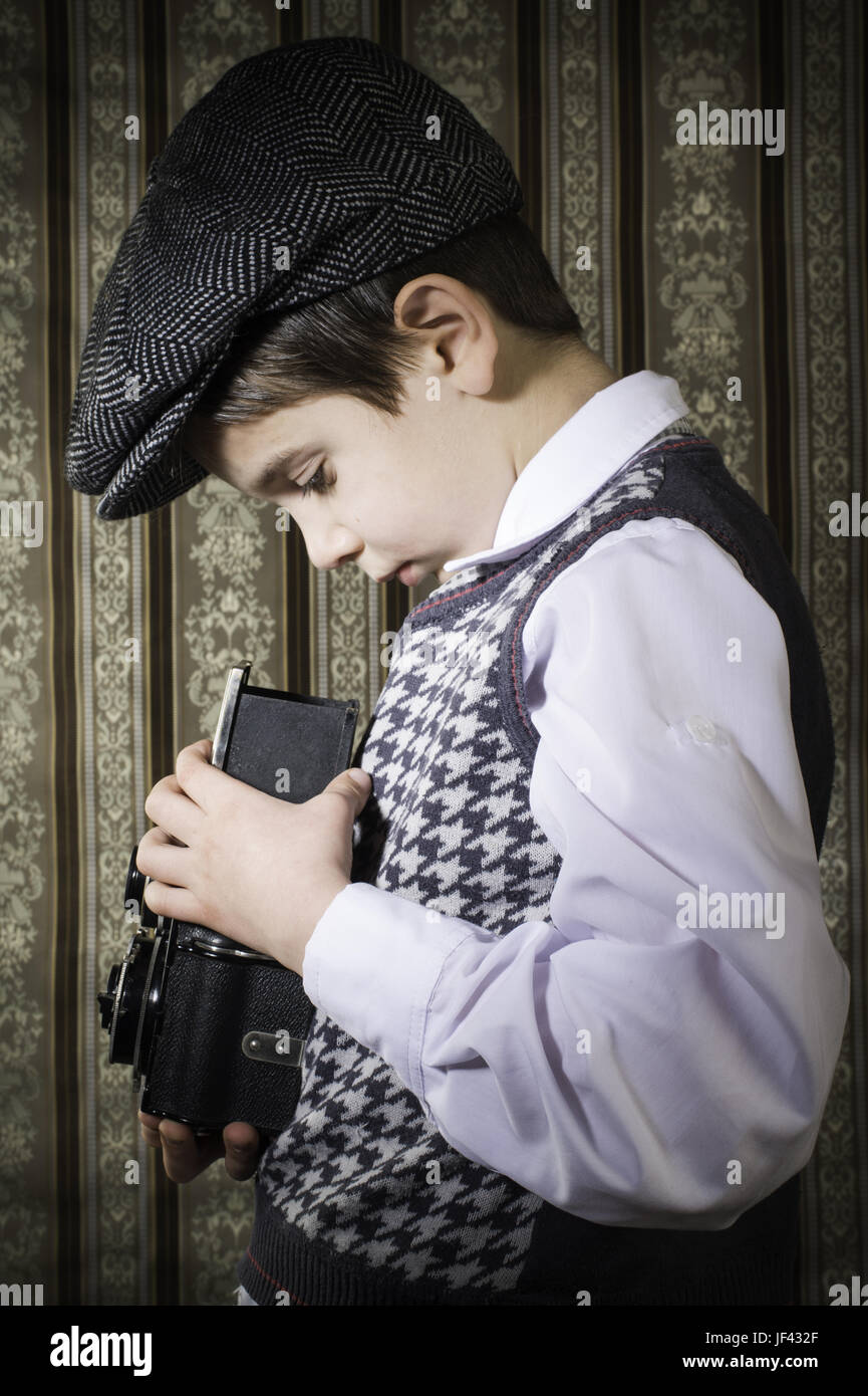 Child taking pictures with vintage camera Stock Photo - Alamy