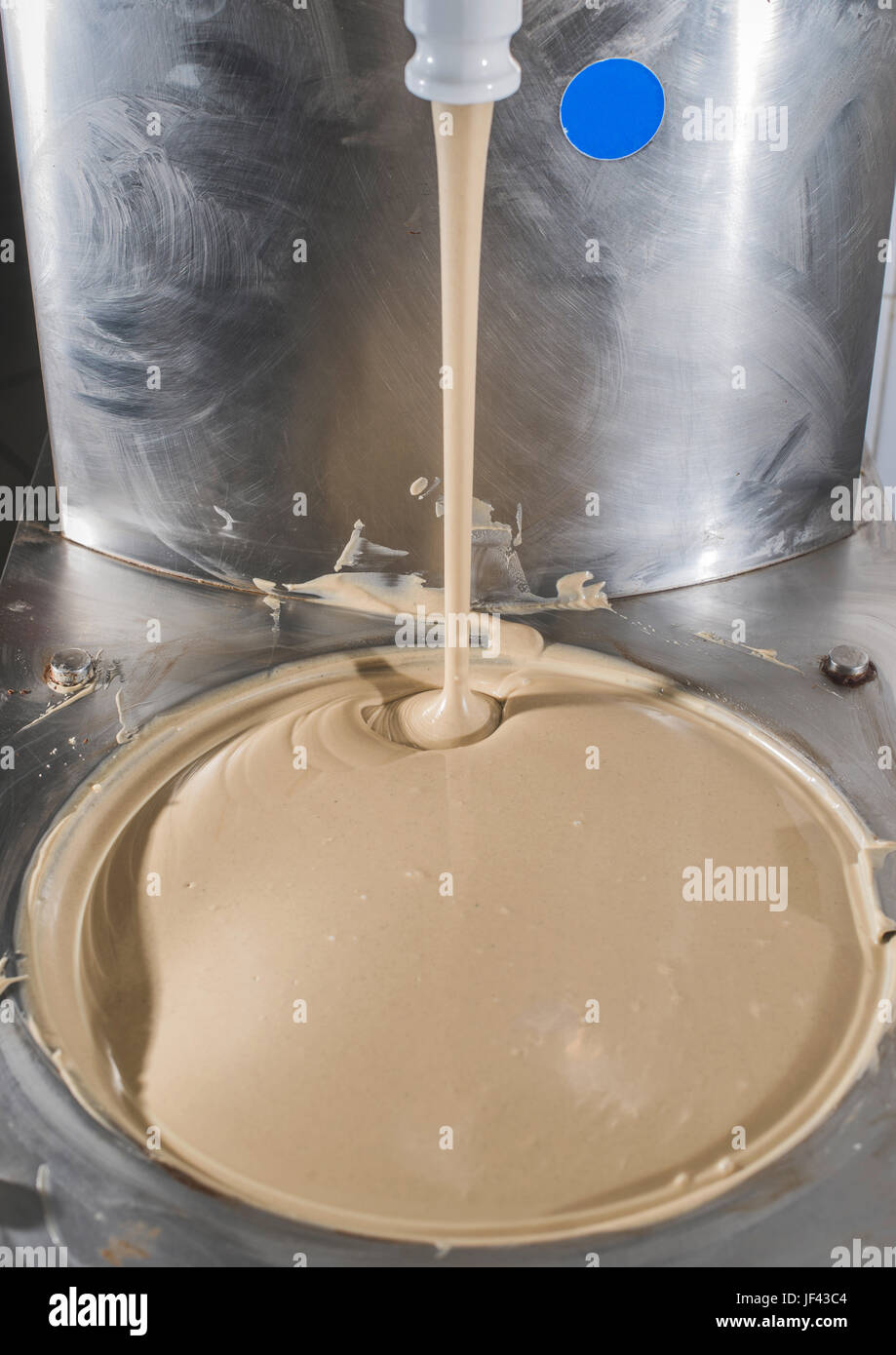 Machine mixing chocolate Stock Photo - Alamy