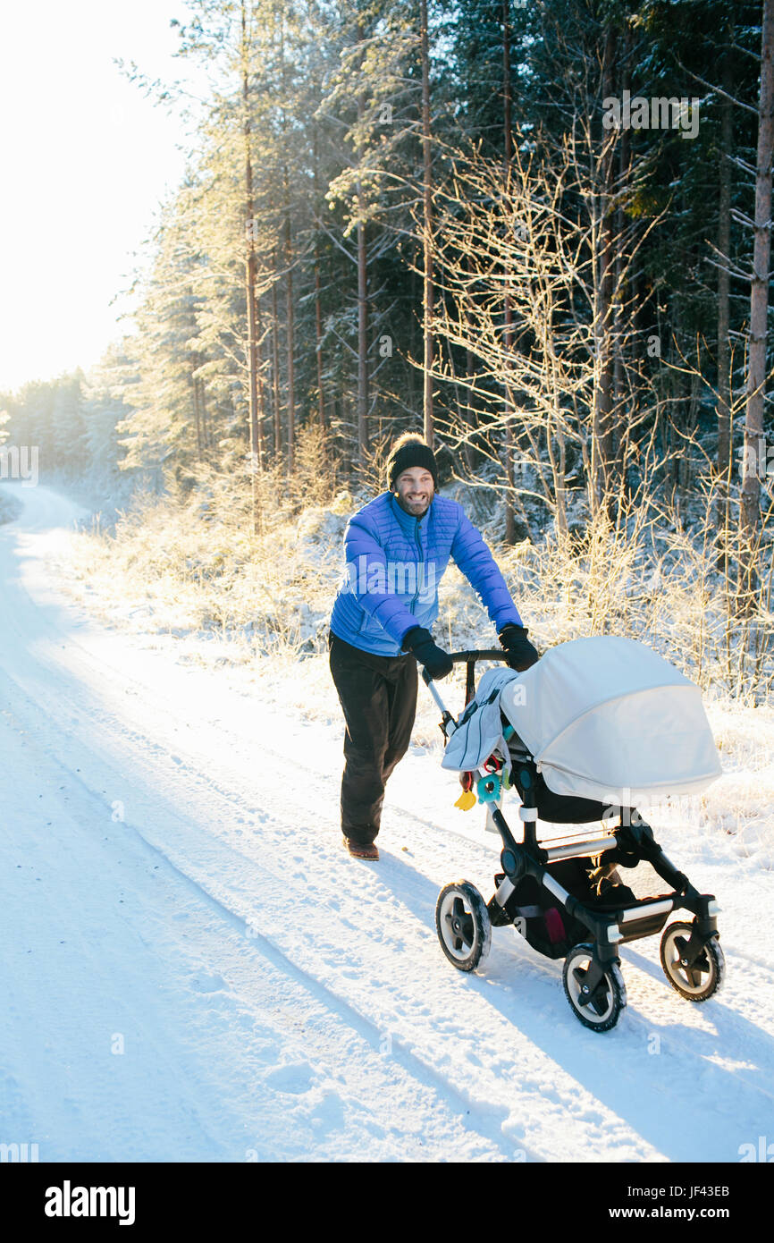 Man walking with buggy Stock Photo - Alamy